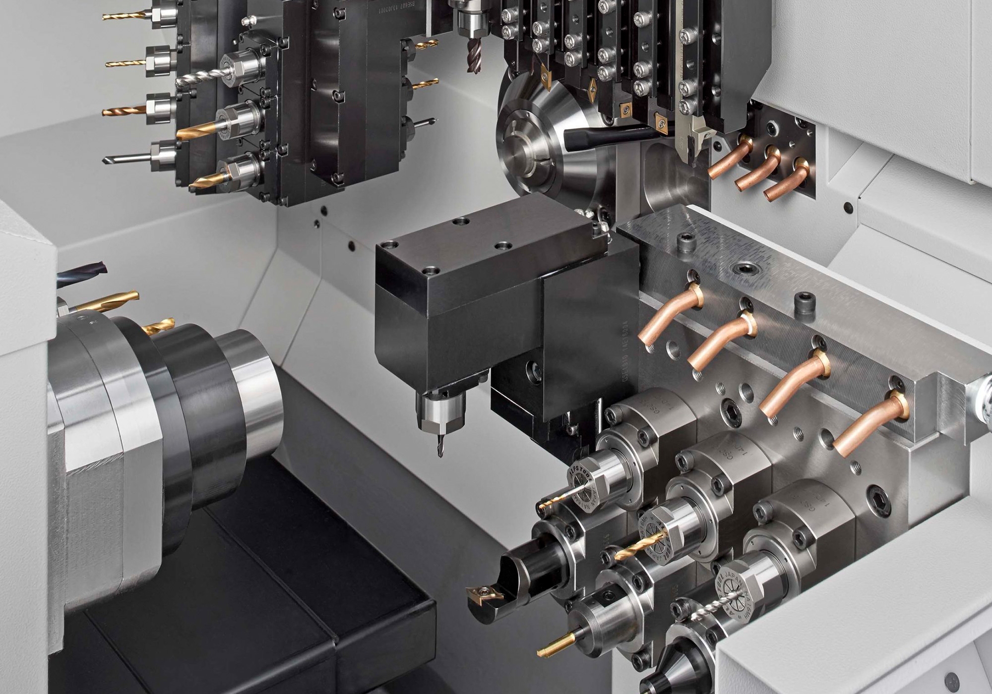 CNC Lathes: Fixed head vs sliding head - Headland